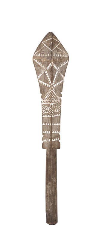 Souvenir handclub from Samoa, c. 1914. With designs picked out in white ...